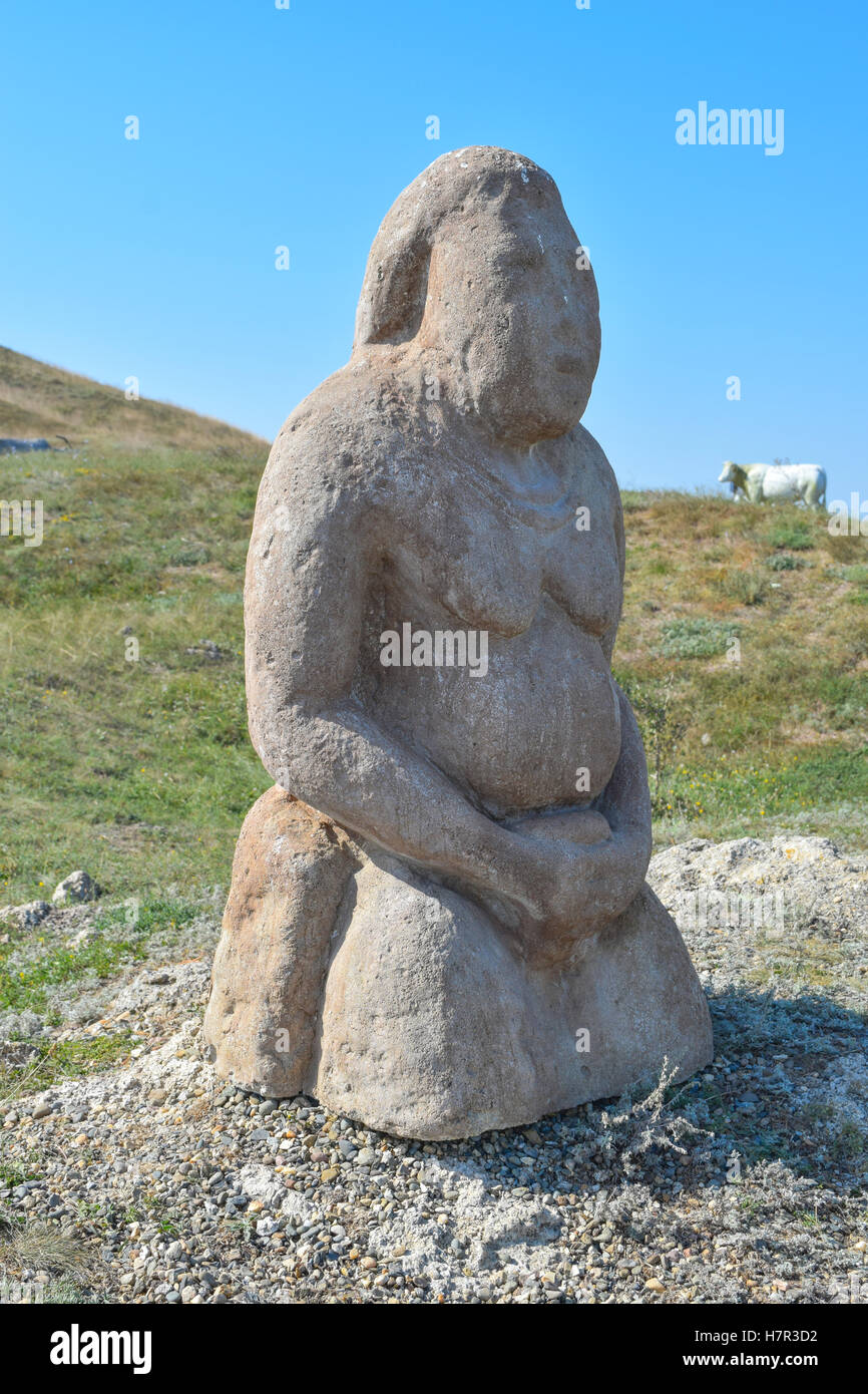 The statue of the pagan god. Stone idol Stock Photo - Alamy