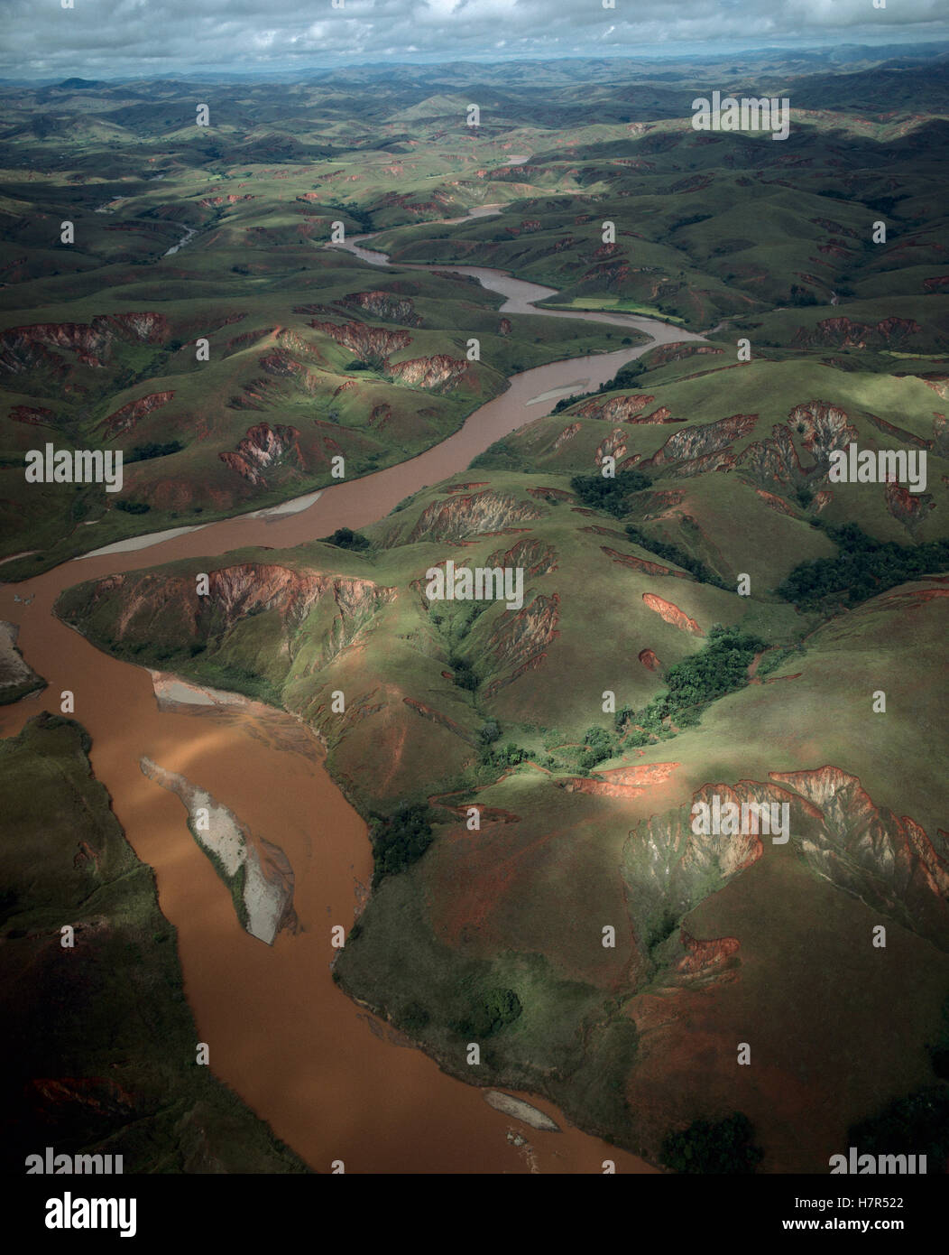 Deforested and deeply eroded hills alongside silted river, Betsiboka ...