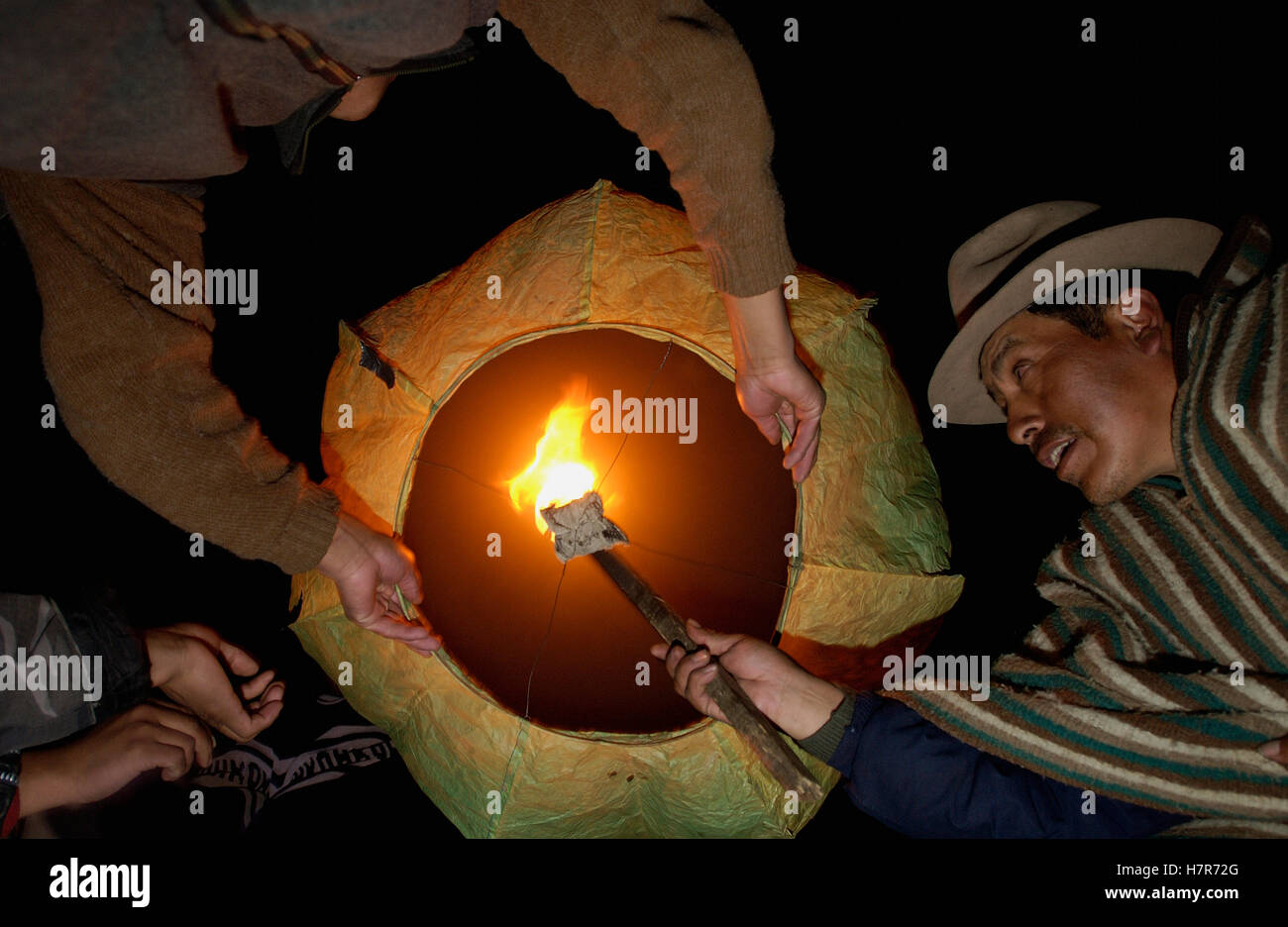 Chagra cowboys lighting a balloon at a hacienda to celebrate a ...