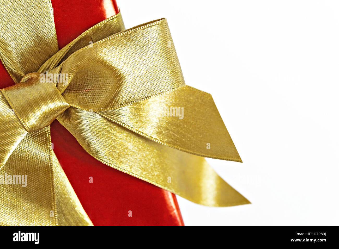 Gift red box with gold ribbon and bow isolated Stock Photo - Alamy