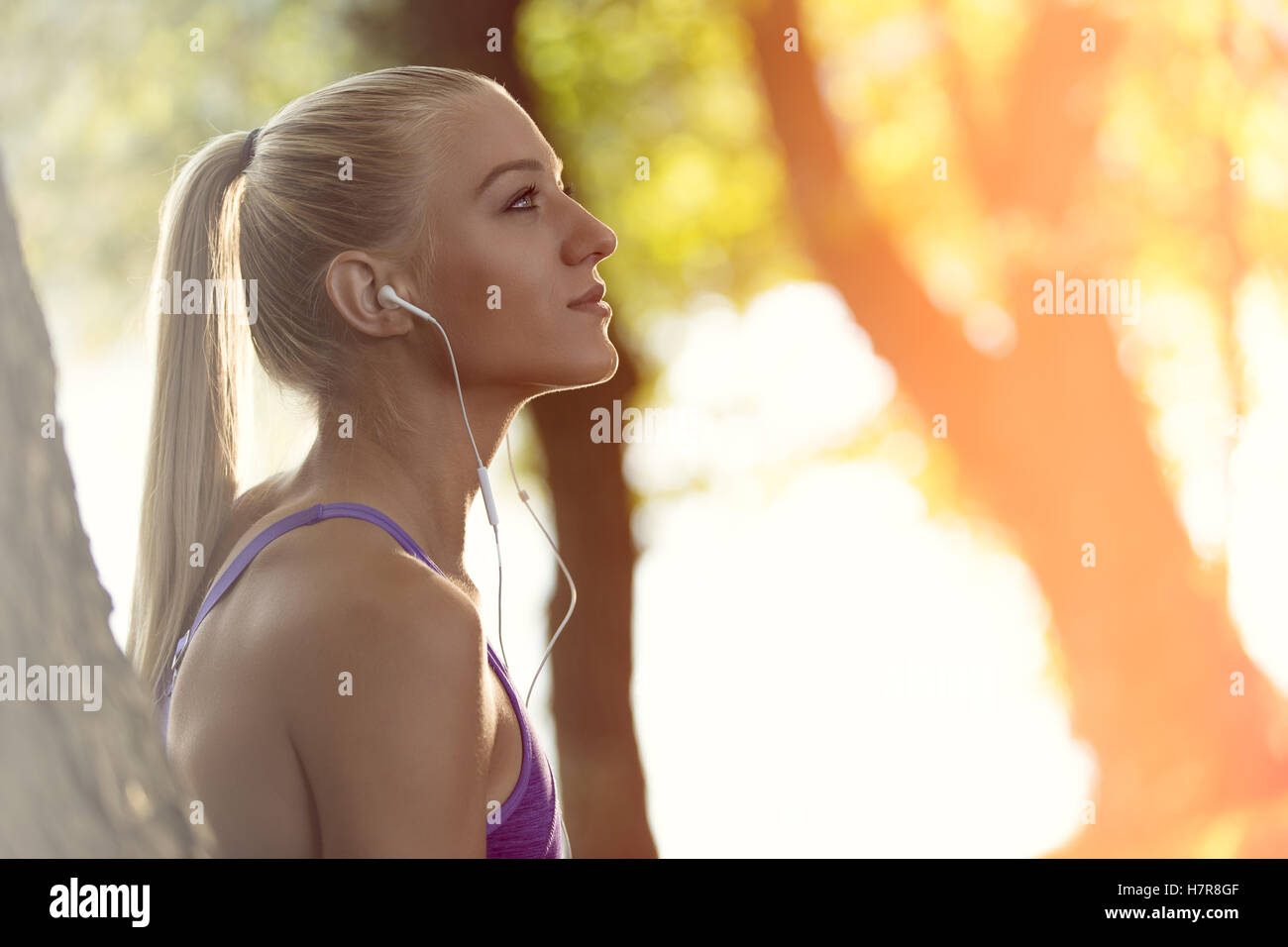 Breathing deep during jogging in the forest Stock Photo - Alamy