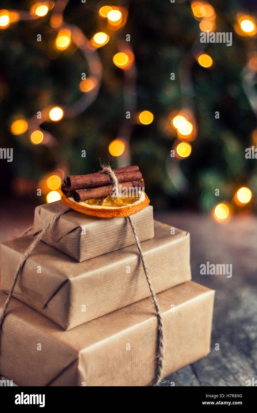 stack of packed gifts on the background of Christmas lights Stock Photo ...