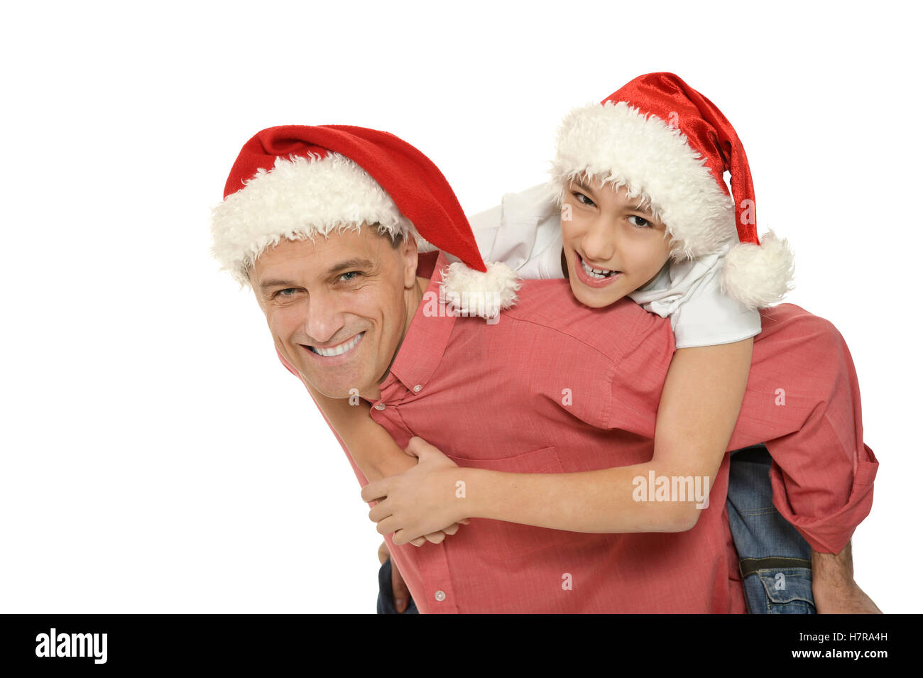 father with son wearing Christmas caps Stock Photo - Alamy