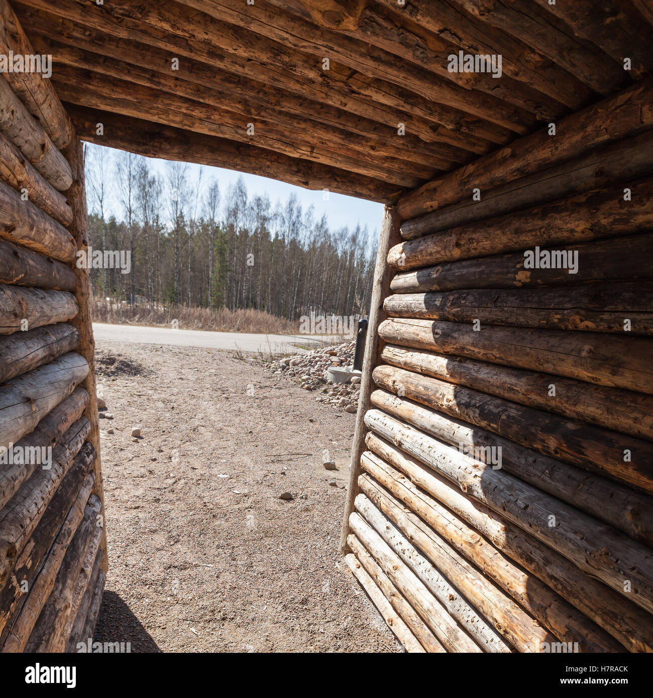 Interior of an empty rural wooden corridor with walls made of rough ...