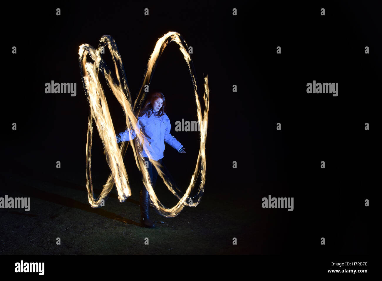 Spinning Fire Poi Stock Photo - Alamy