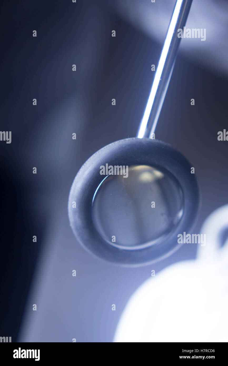 Doctor's reflex hammer tool used to test patient reflexes in knee and ...