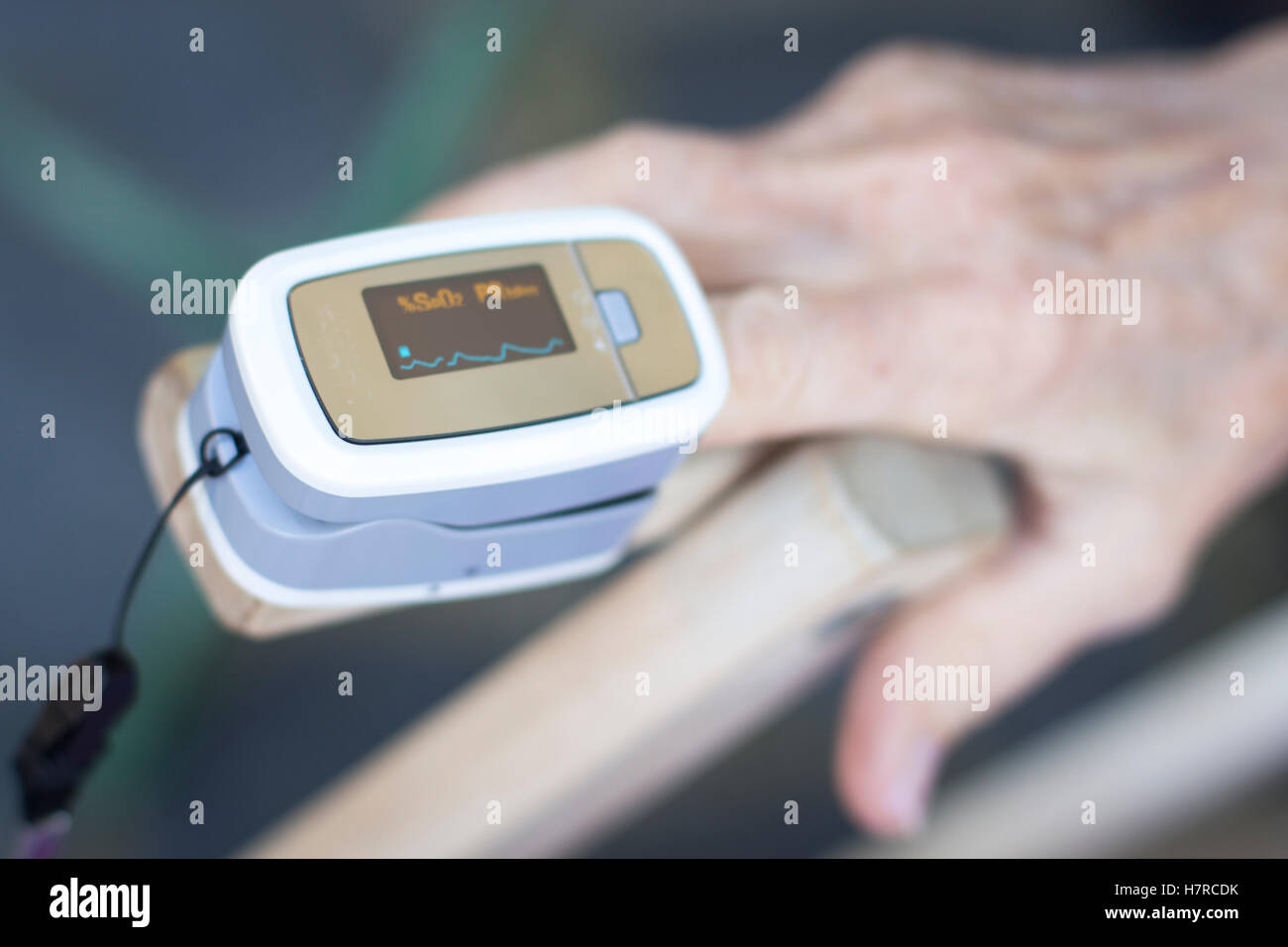 Portable hand held domestic cardiac finger pulse rate meter to show ...