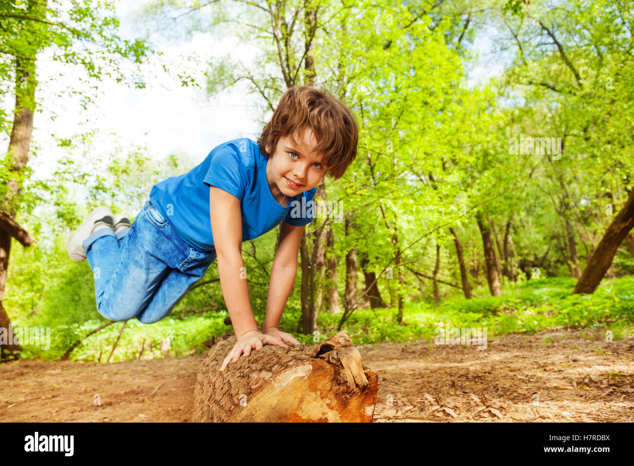 Children forest play boy log hi-res stock photography and images - Alamy
