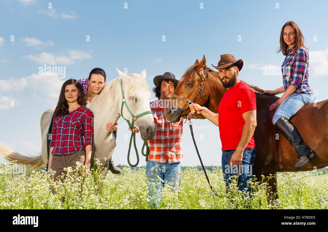 Portrait of five happy young horseback riders Stock Photo - Alamy