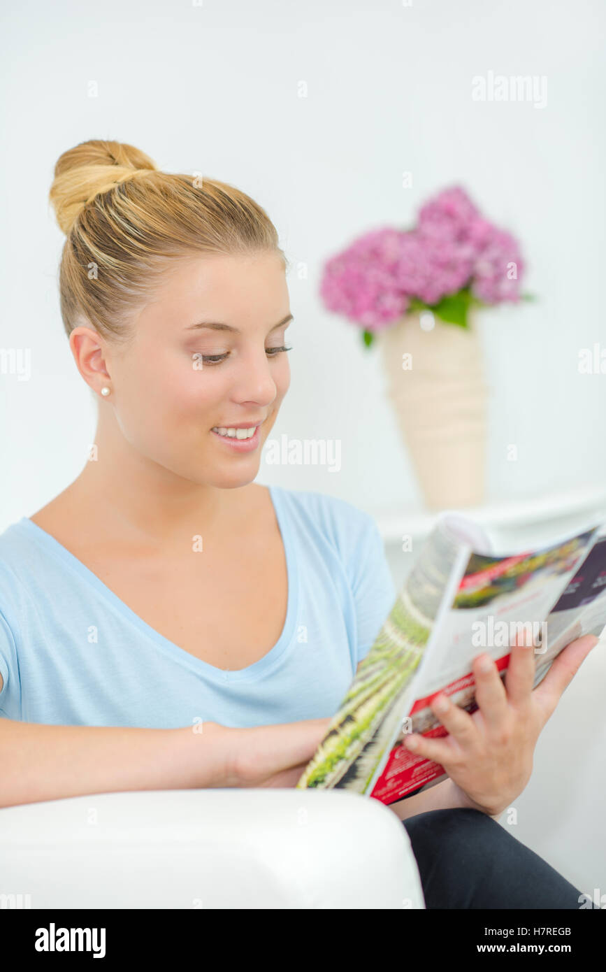 Lady reading magazine Stock Photo - Alamy