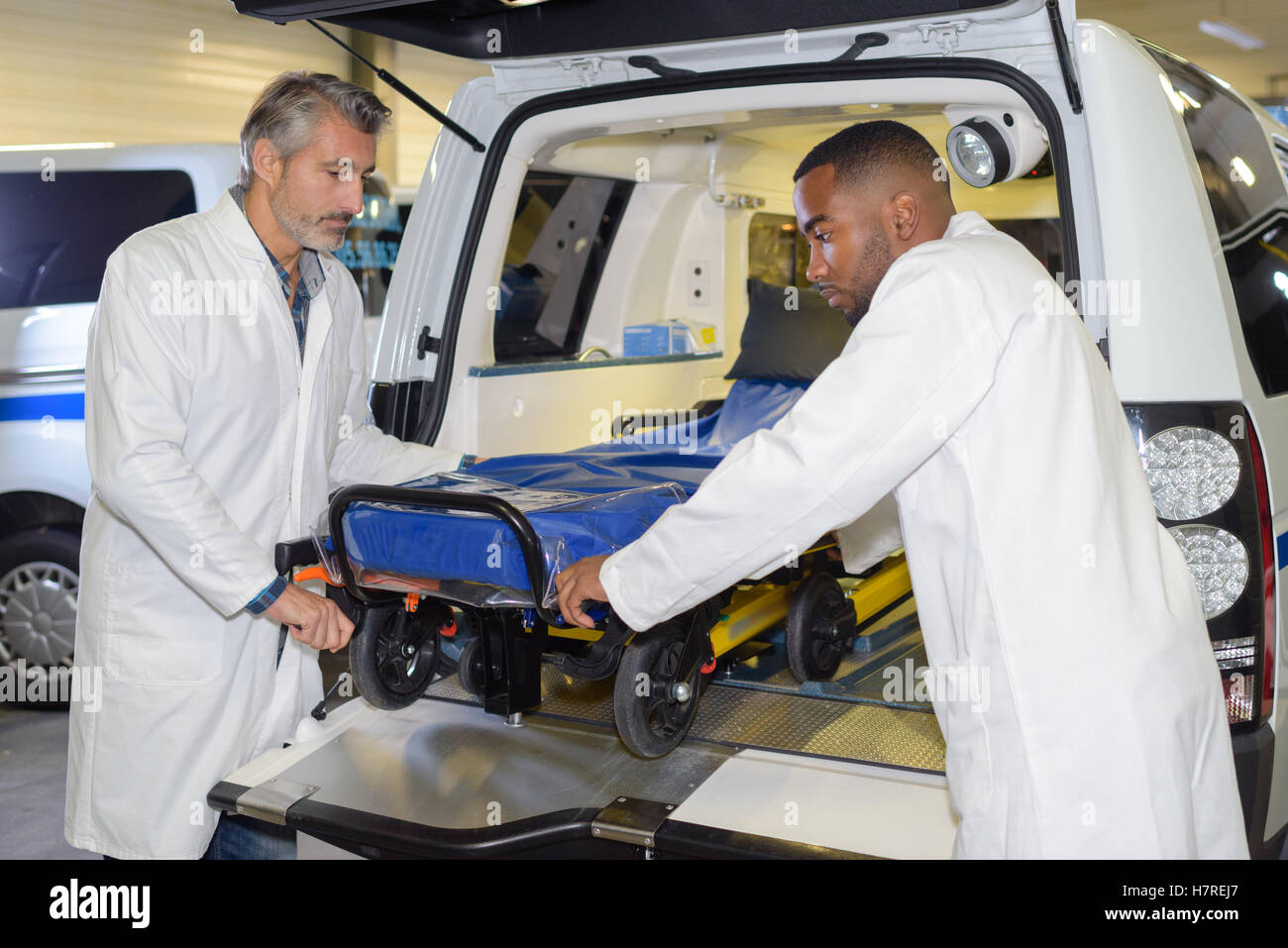 paramedics folding the bed Stock Photo - Alamy