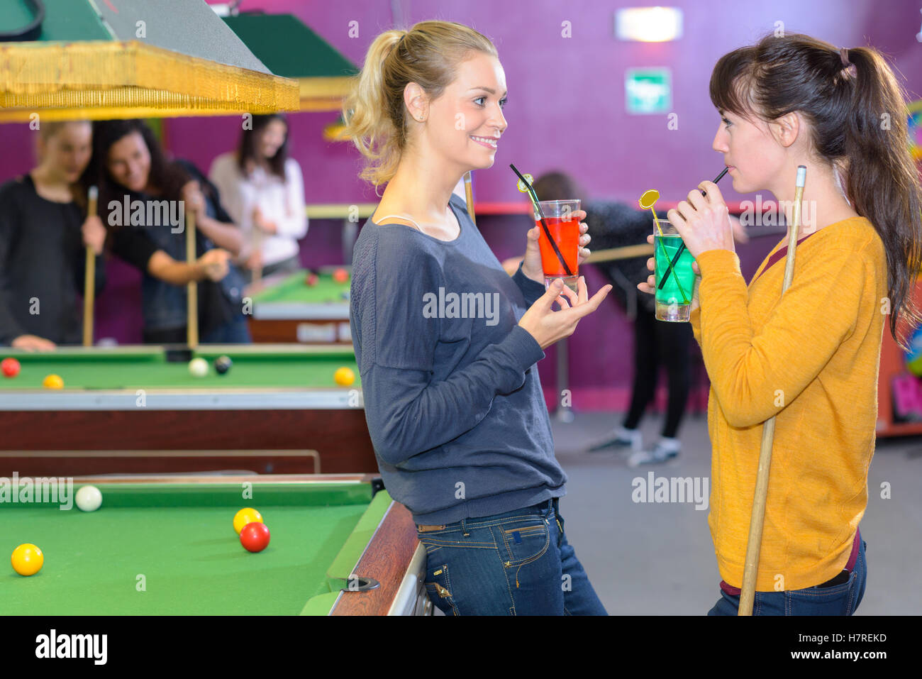 Women in pool hall with drinks Stock Photo - Alamy