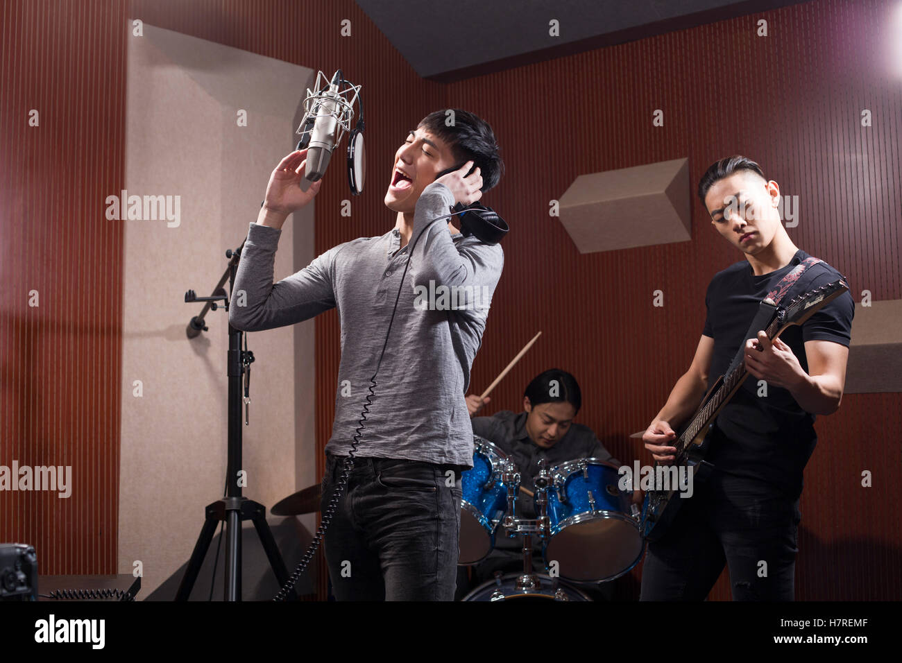 Chinese musical band in recording studio Stock Photo - Alamy