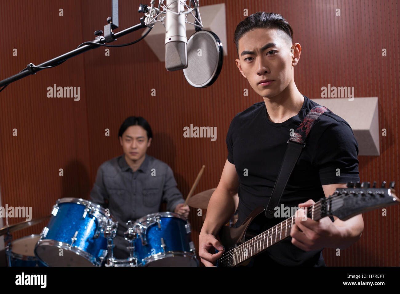 Chinese musical band in recording studio Stock Photo - Alamy