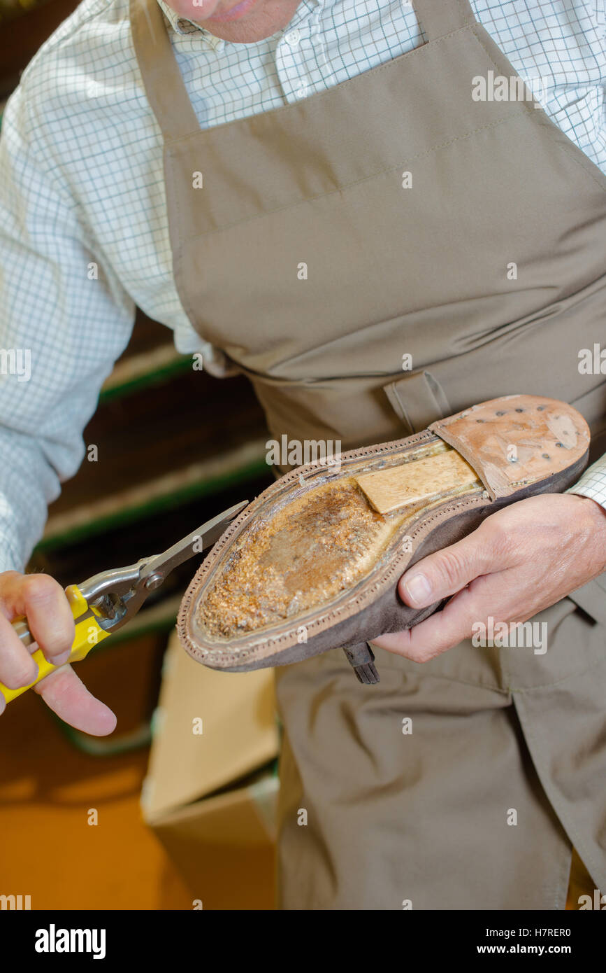 Fixing shoe hi-res stock photography and images - Alamy