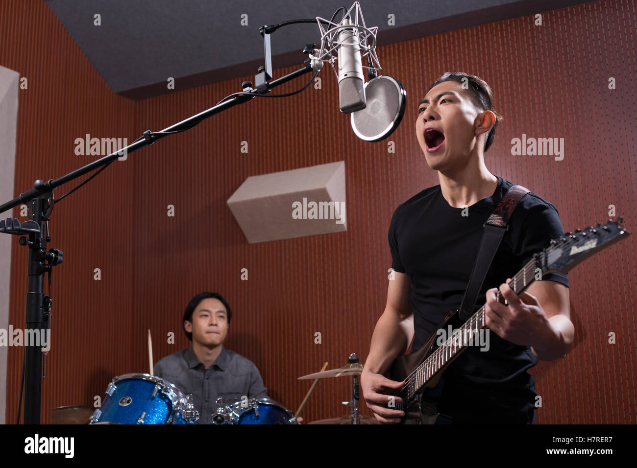 Chinese musical band in recording studio Stock Photo - Alamy