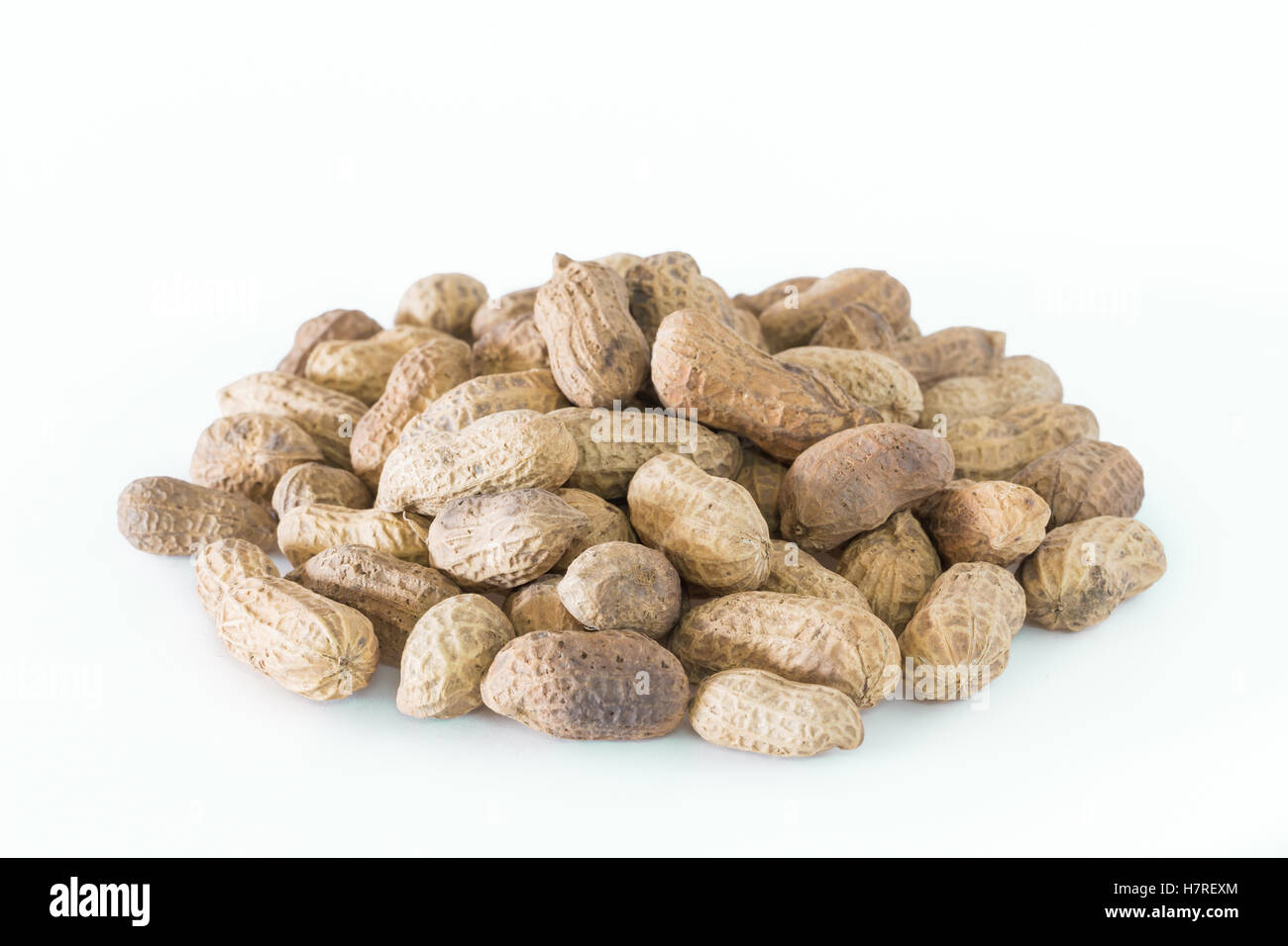 Dry roasted peanuts isolated on white background Stock Photo - Alamy