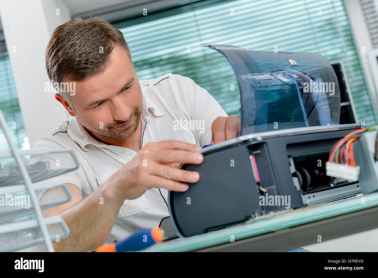 Fixing a printer Stock Photo - Alamy