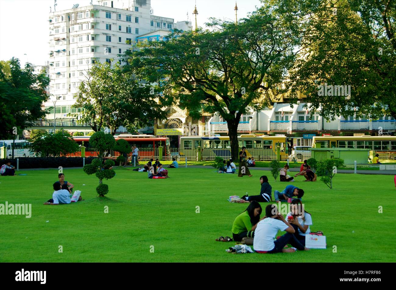 Yangon, Myanmar - 11 November 2014. Young Burmese relaxing in the Maha ...