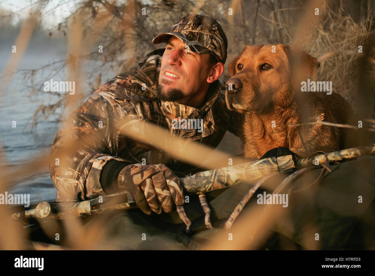 Duck hunter in boat hi-res stock photography and images - Alamy