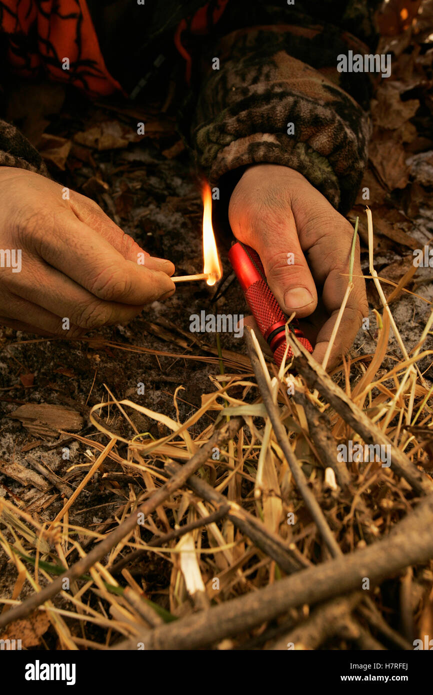 Hunter Making Fire With Waterproof Matches for Survival Stock Photo - Alamy