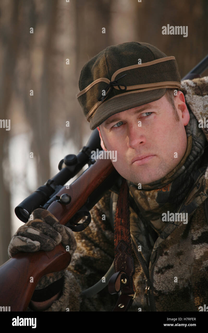Hunter holding rifle looking away hi-res stock photography and images ...