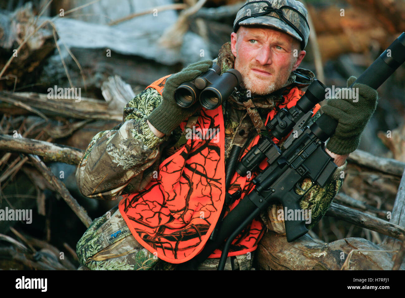 Whitetail Deer Hunter With Rifle In Woods Stock Photo - Alamy