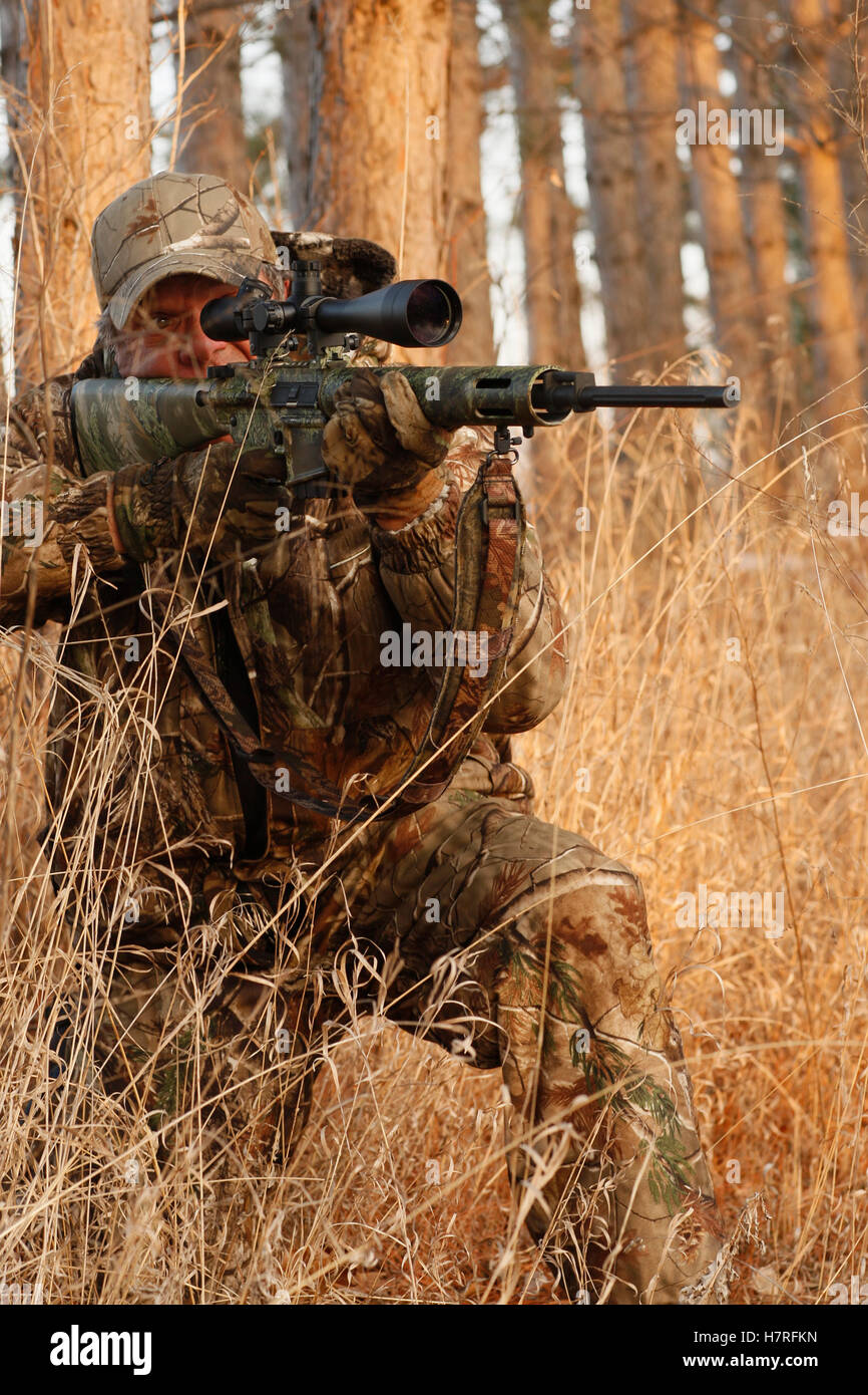 Predator Hunter Aiming Rifle Stock Photo - Alamy