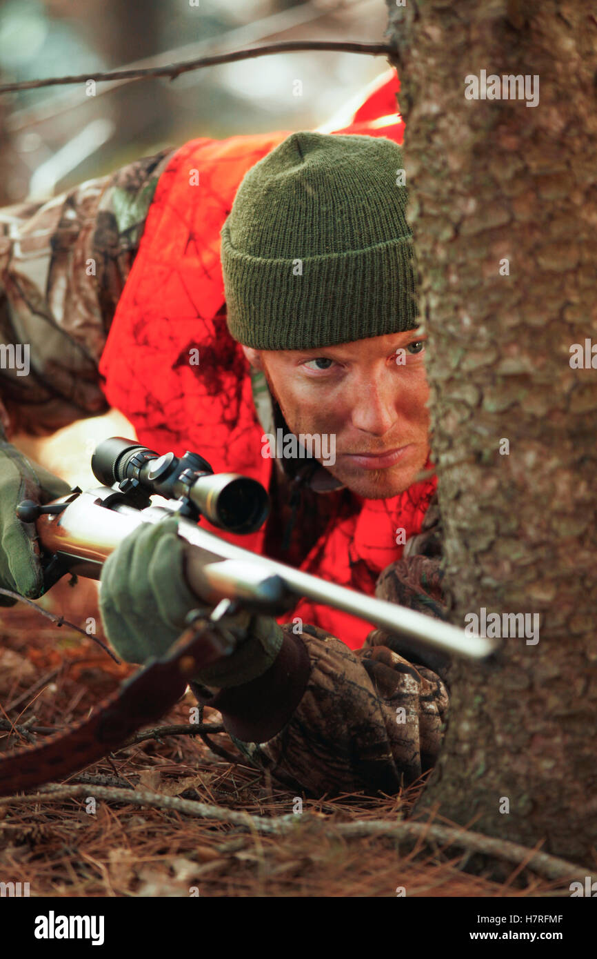 Deer Hunter Stalking With Rifle Stock Photo - Alamy