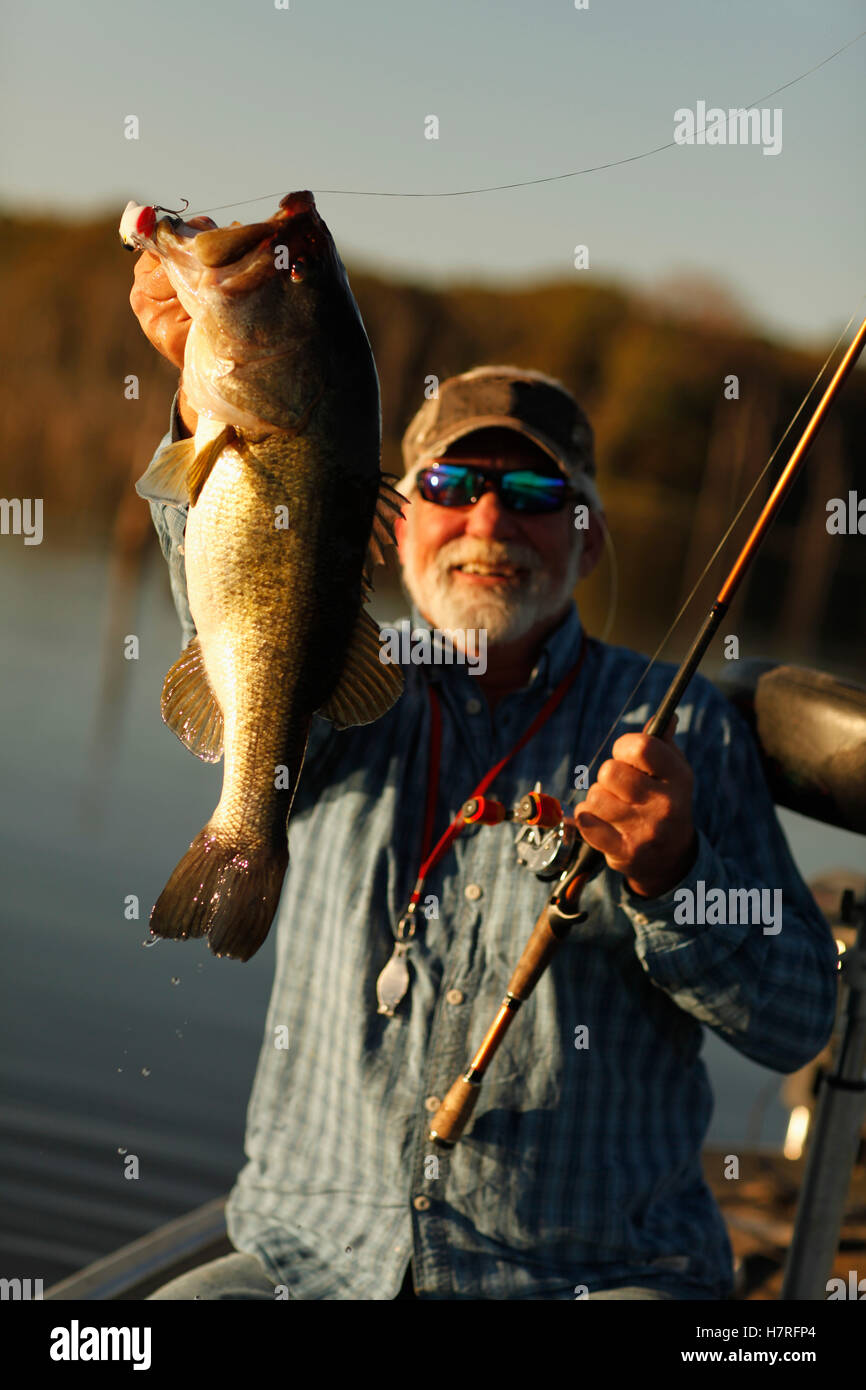 Bass Fisherman Lips Fish After Catching It Stock Photo - Alamy