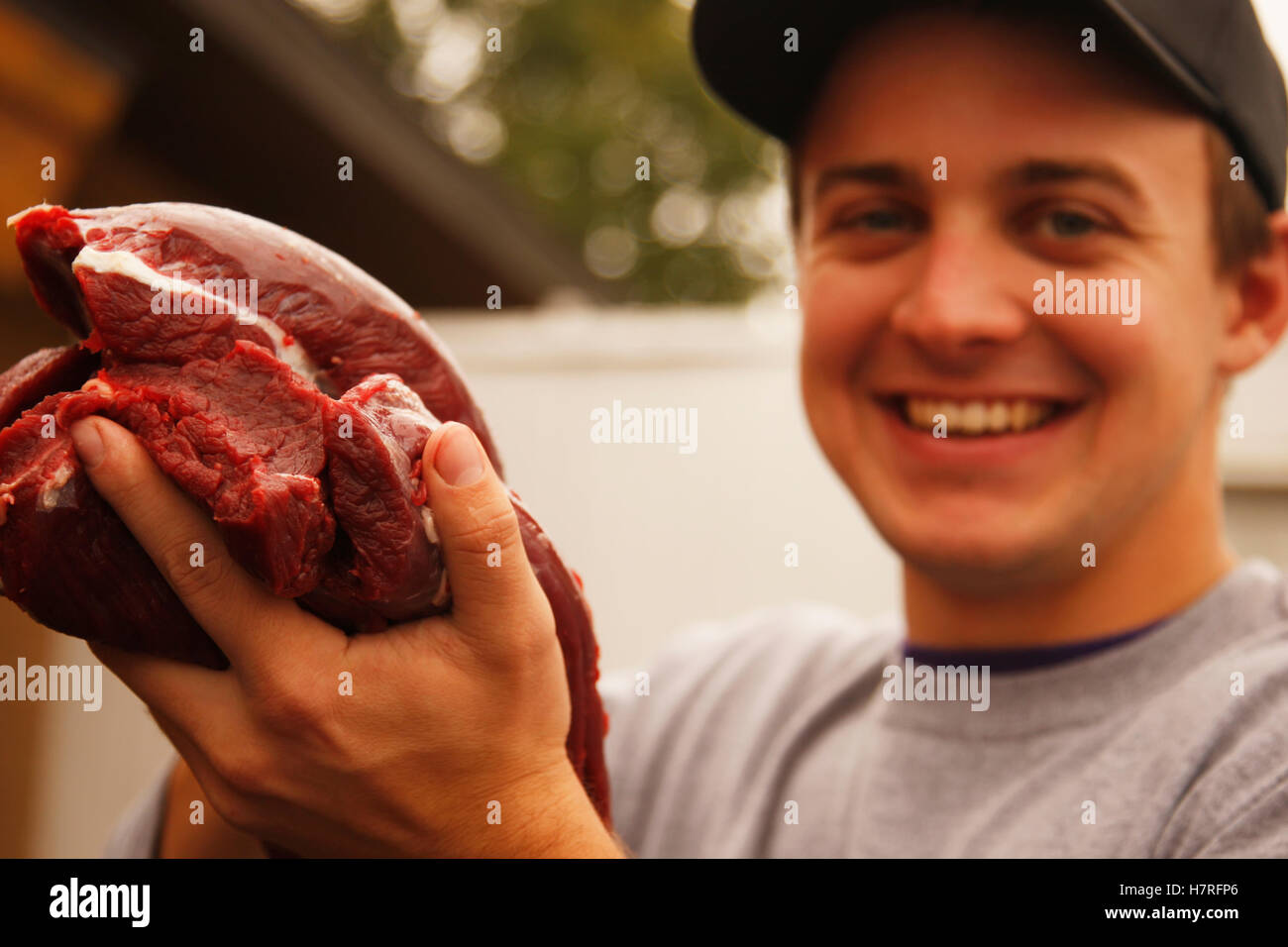 Bear Roast In Hunter''S Hands Stock Photo - Alamy