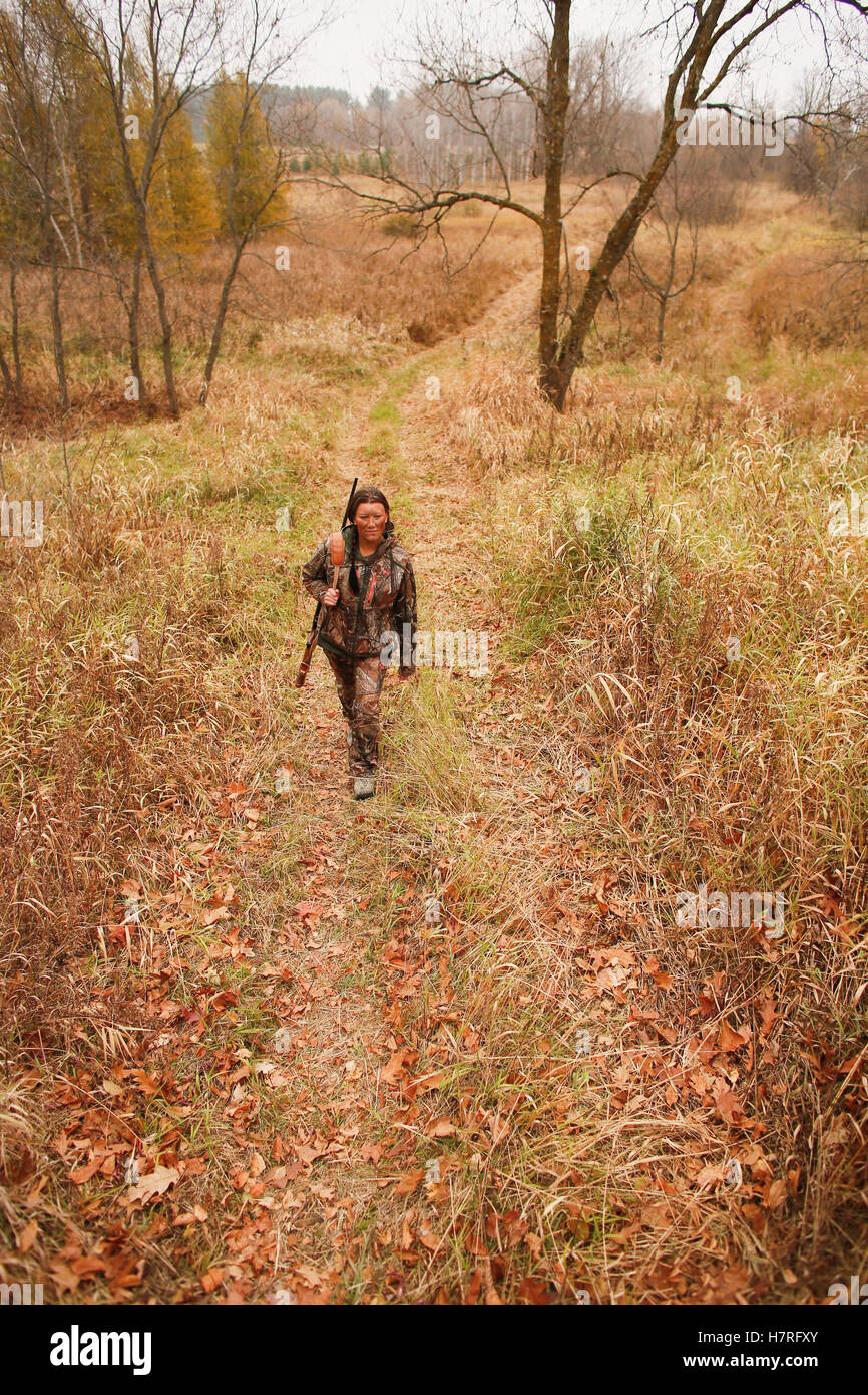 Bear Hunter Walks Along Logging Trail Stock Photo - Alamy