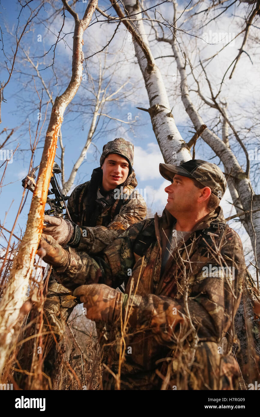 Father And Son Looking At Deer Scrape Stock Photo - Alamy