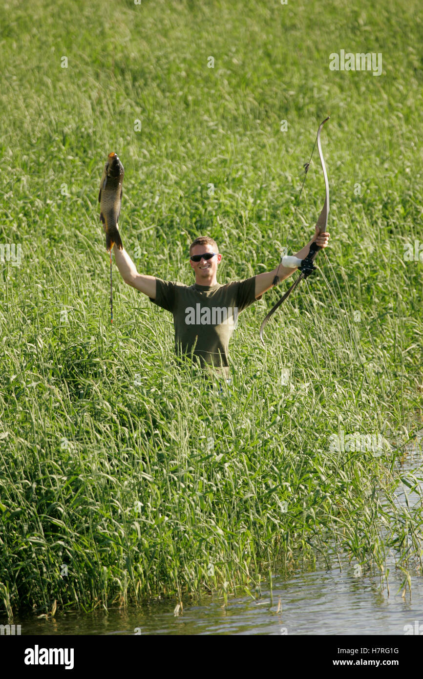 Successful Catch Of Carp Bowfishing Stock Photo - Alamy