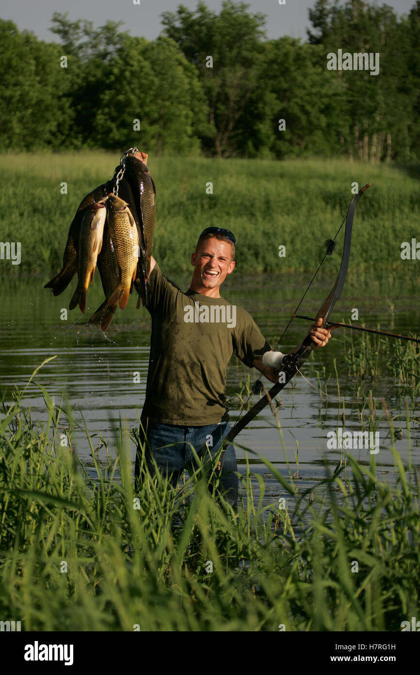 Man Bowfishing Carp Stock Photo - Alamy