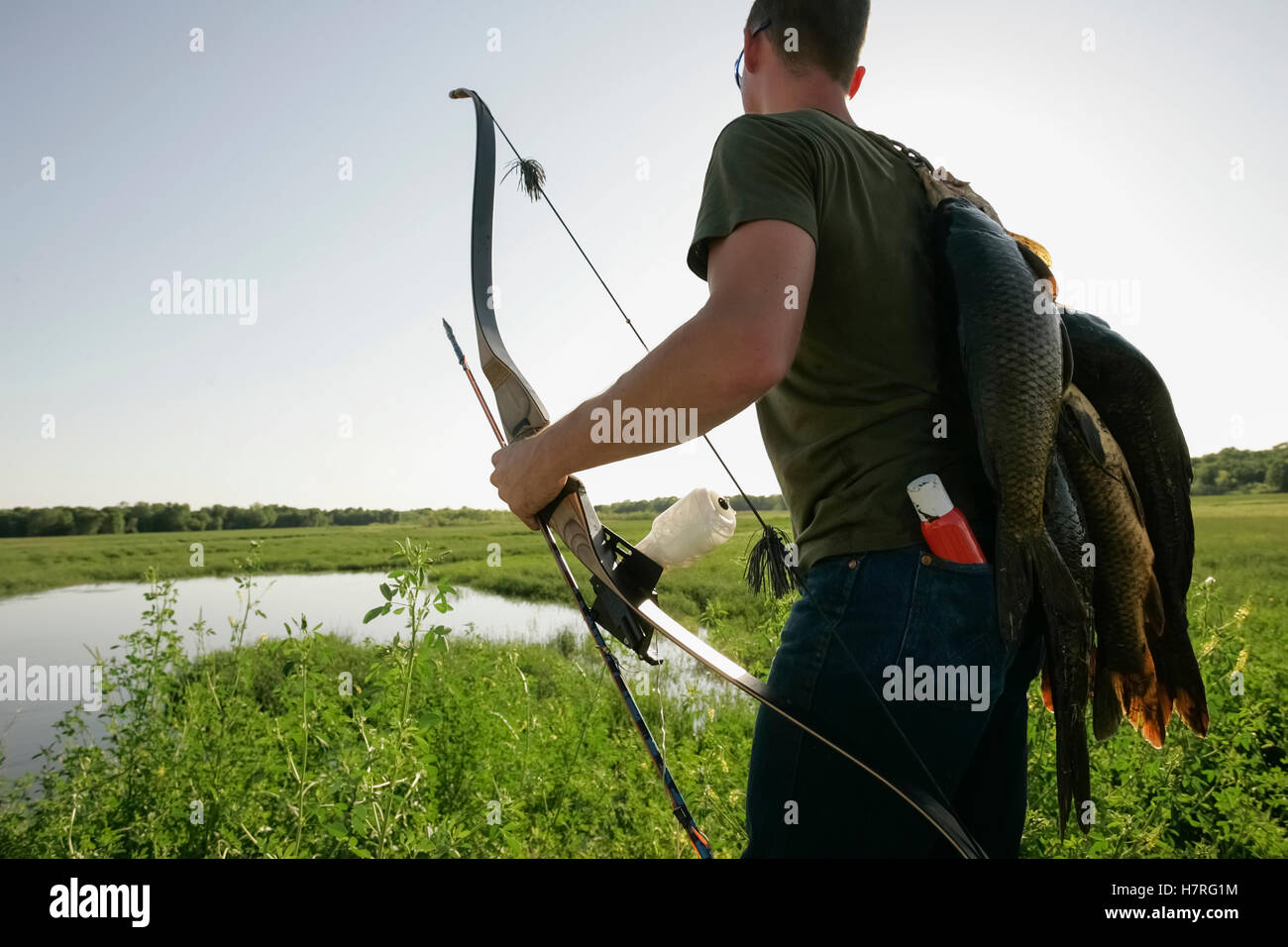 Man Bowfishing Carp Stock Photo - Alamy