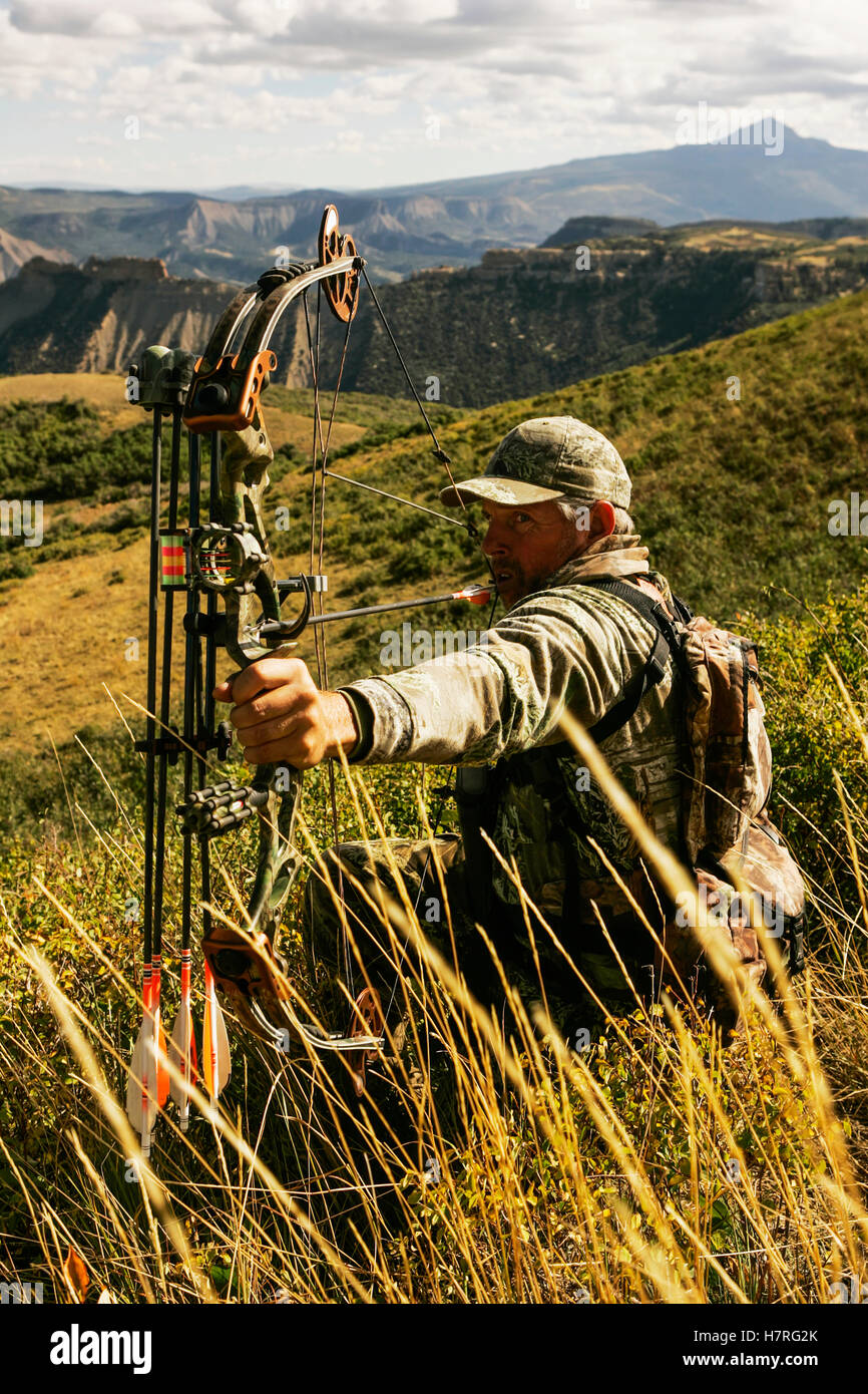Elk Hunter Drawing Bow Stock Photo - Alamy