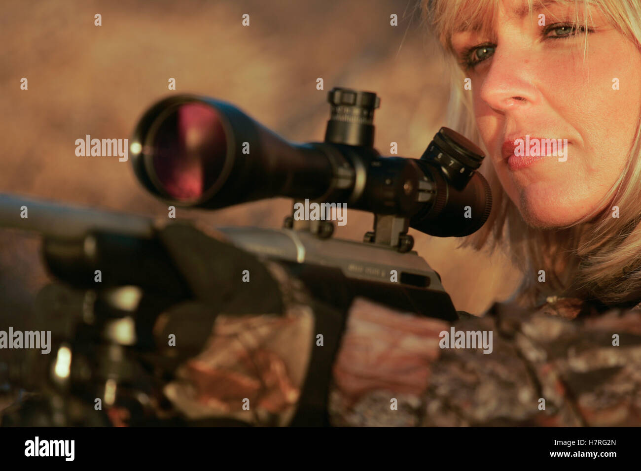 Female Varmint Hunter with Rifle Stock Photo - Alamy