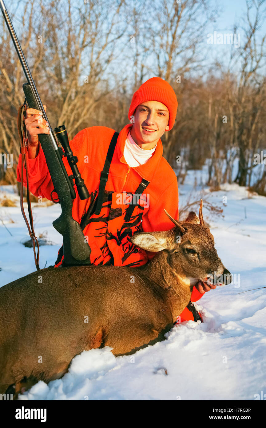 Young Male Hunting With Dead Deer Stock Photo - Alamy