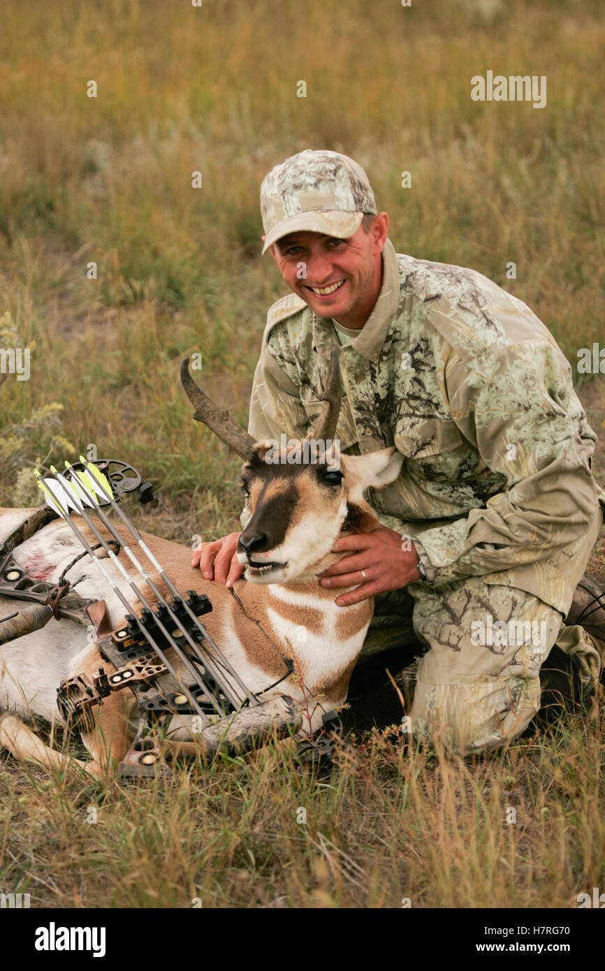 Hunter With Dead Antelope Stock Photo - Alamy
