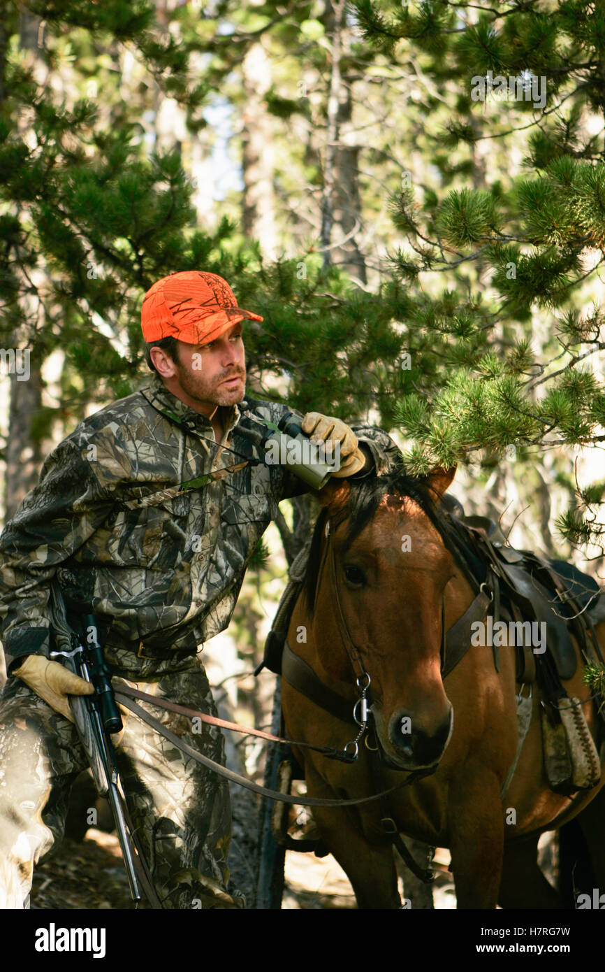 Big Game Hunter With Pack Horse Stock Photo - Alamy