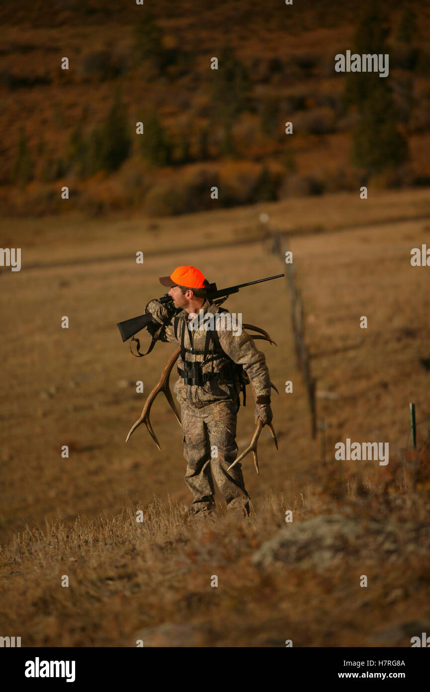 Big Game Hunter With Western Elk Rack On Back Stock Photo - Alamy