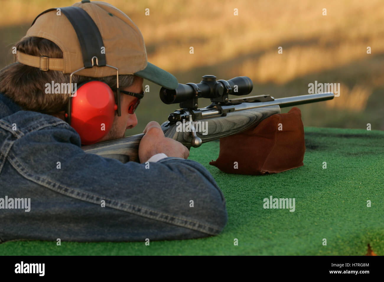 Man Shooting Rifle On Shooting Range Stock Photo - Alamy