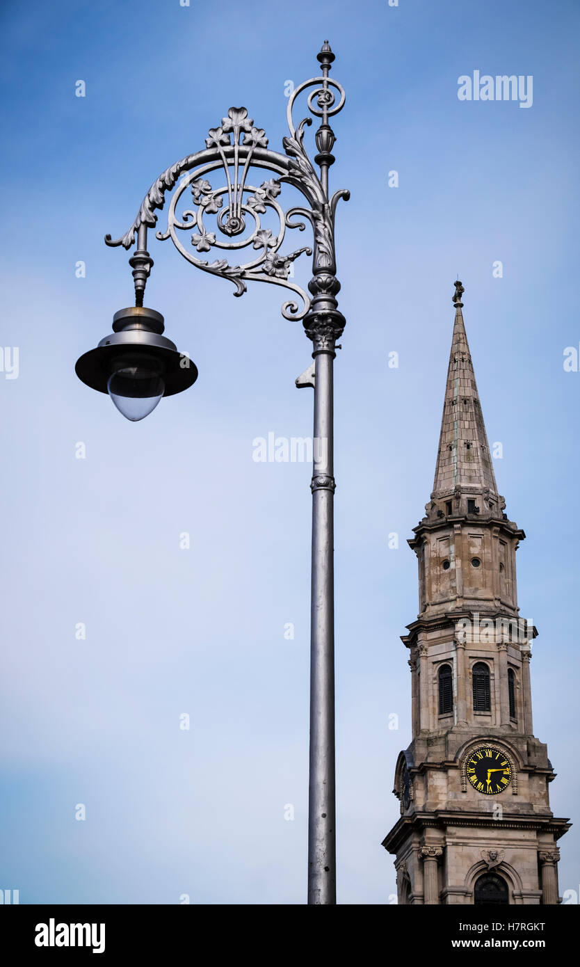 A ornate and decorative street light and clock tower; Dublin, Ireland ...