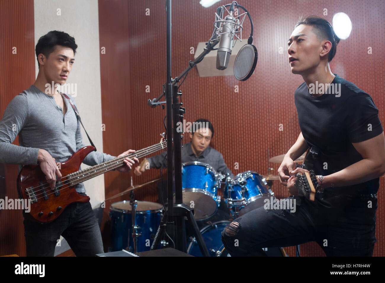 Chinese musical band in recording studio Stock Photo - Alamy
