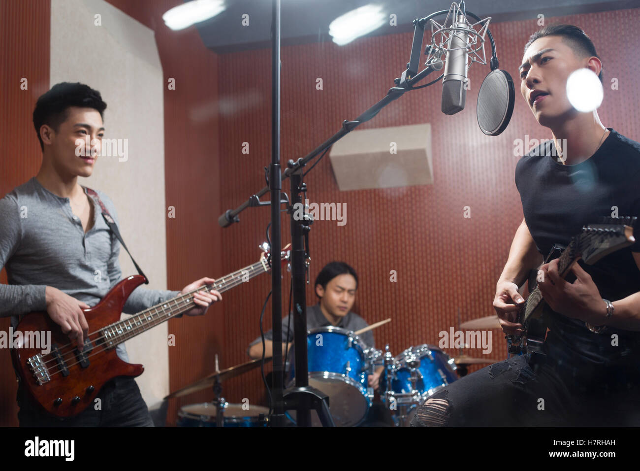 Microphone standing holding arts culture and entertainment musical instrument hi-res stock ...