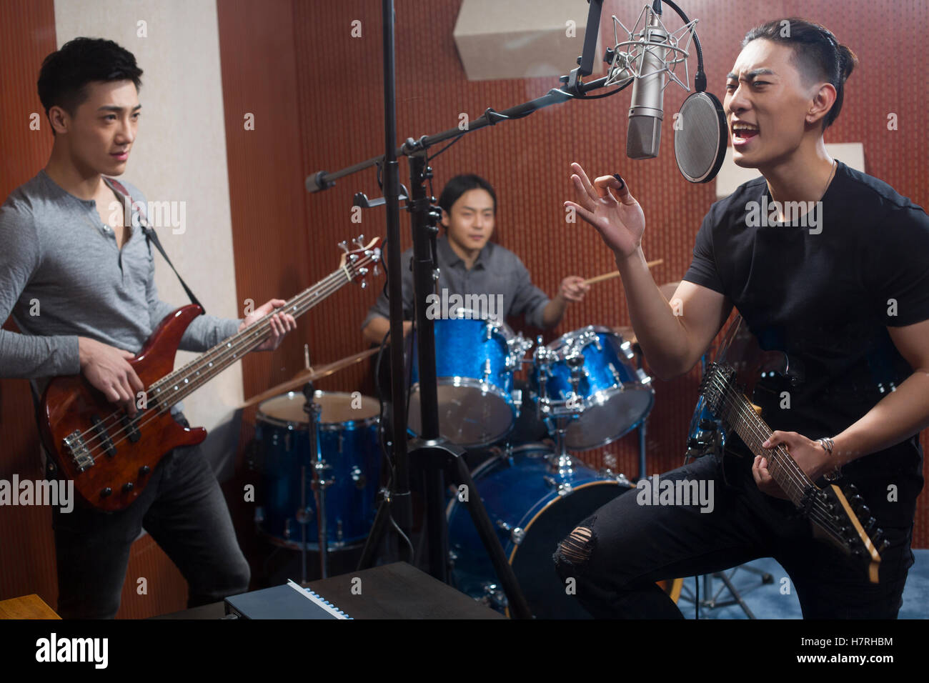 Chinese musical band in recording studio Stock Photo - Alamy