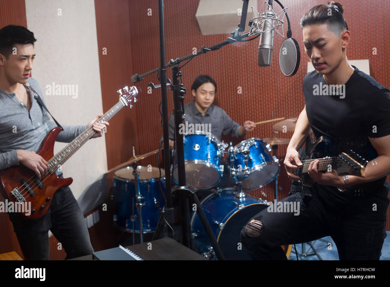 Microphone standing holding arts culture and entertainment musical instrument hi-res stock ...