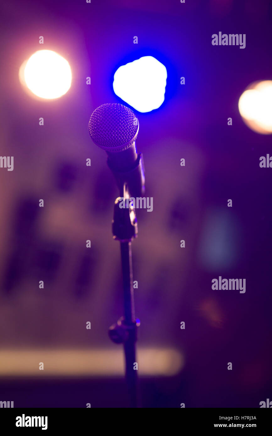 Microphone on stage Stock Photo - Alamy