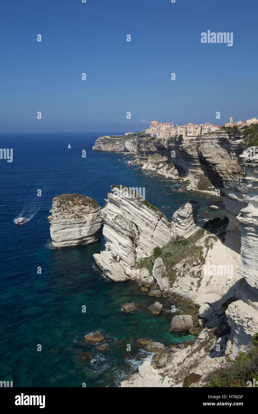Bonifacio citadel perched on dramatic white cliffs overlooking blue sea ...